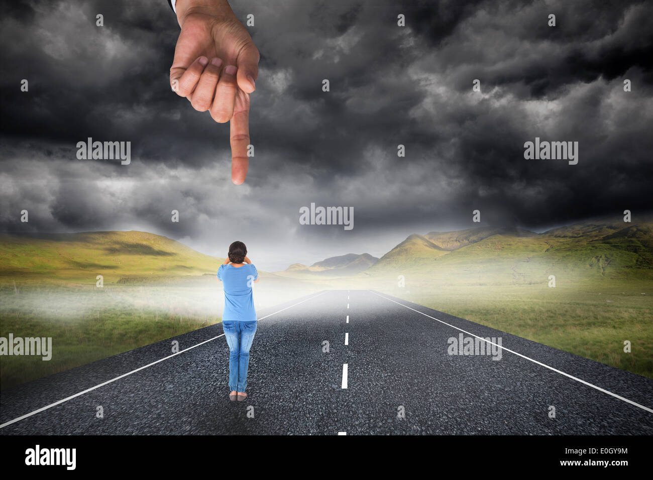 Giant hand pointing at pretty brunette shouting Stock Photo - Alamy