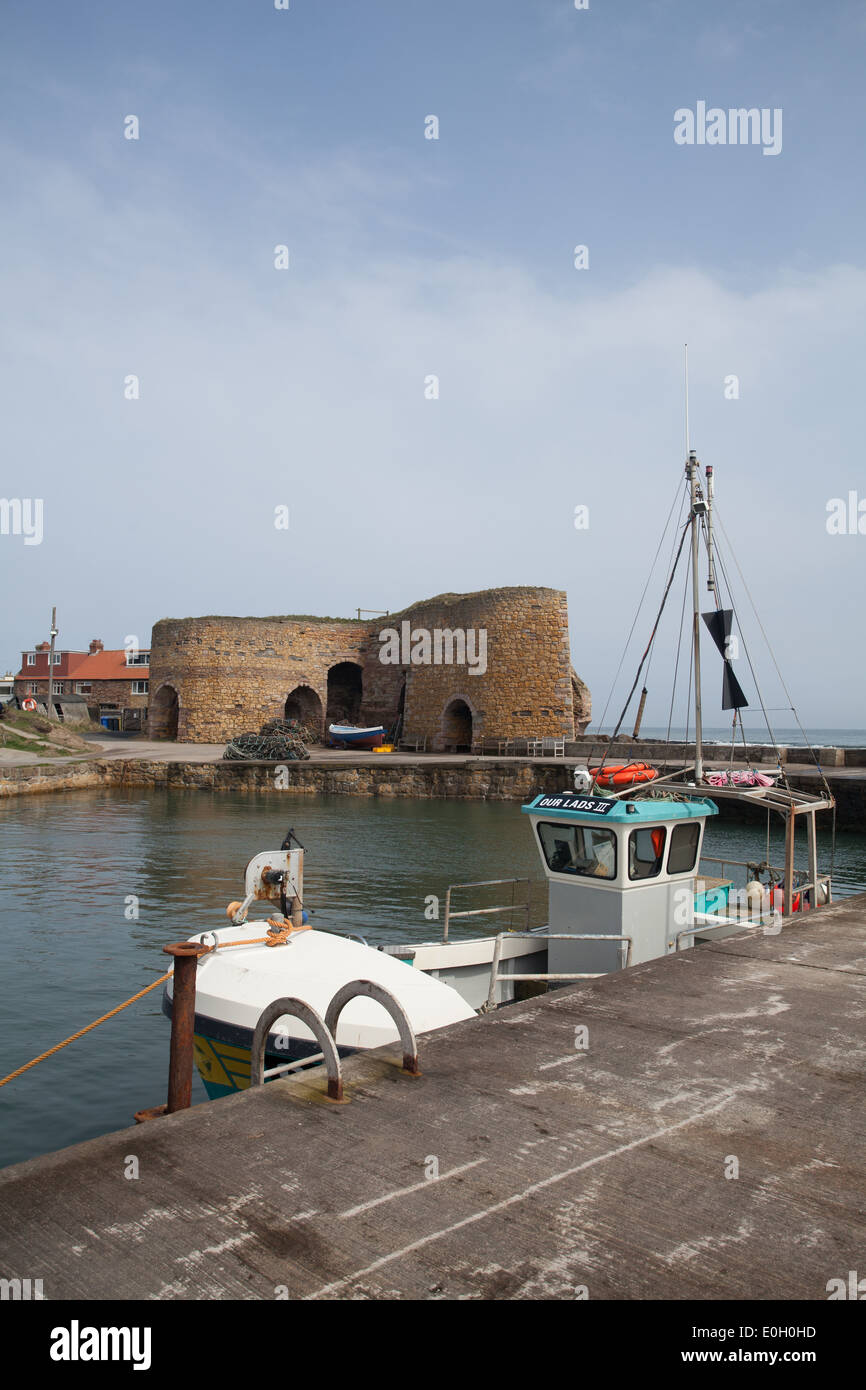 lime kilns and fishing boat at Beadnell harbour Northumberland UK Stock ...