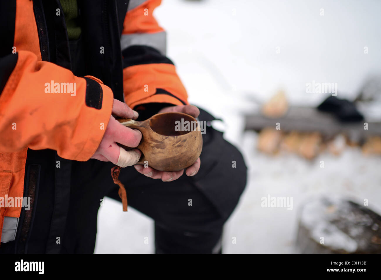 Antti holds a Kuksa, traditional lappish wooden cup made of birch burl ...