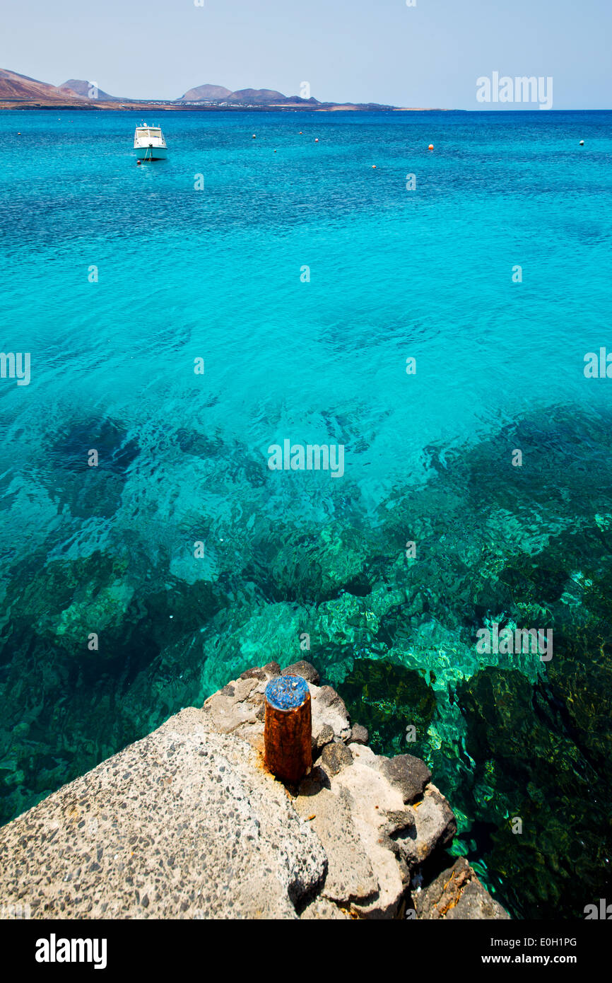 rusty metal yacht spain harbor pier boat in the blue sky arrecife ...