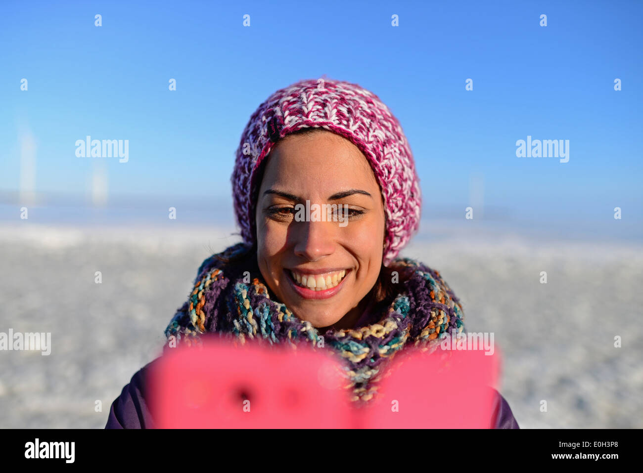 Young woman using mobile phone during Sampo Icebreaker cruise, an ...
