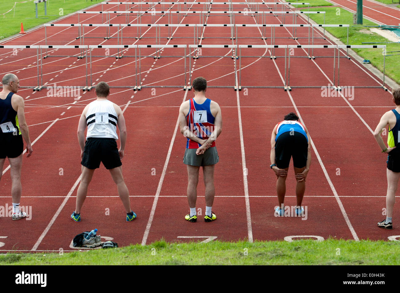 Athletics, runners at start of men`s 110m hurdles race at club level ...