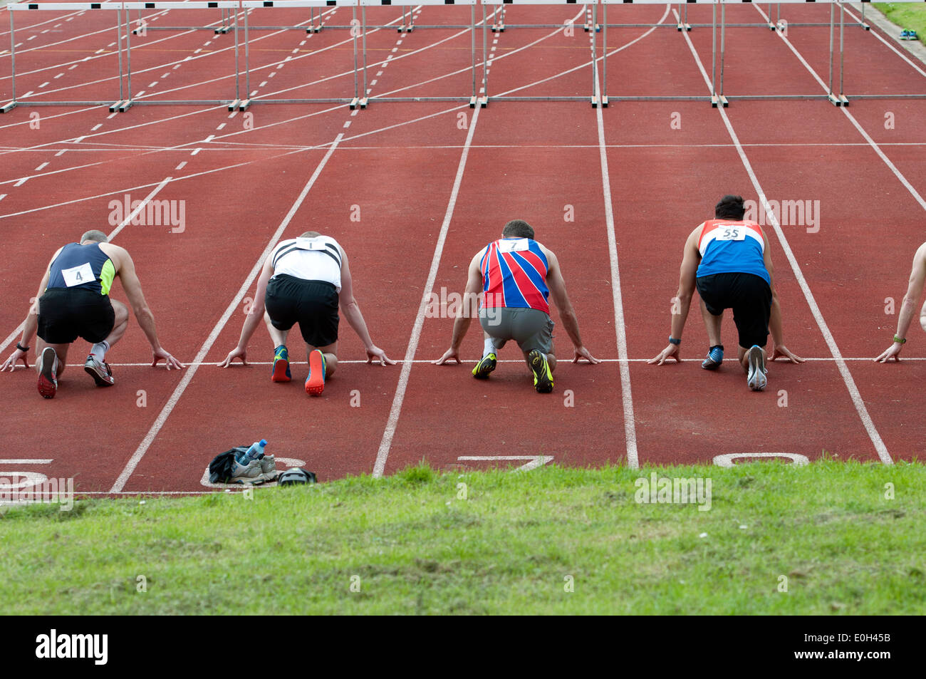 Athletics, runners at start of men`s 110m hurdles race at club level ...
