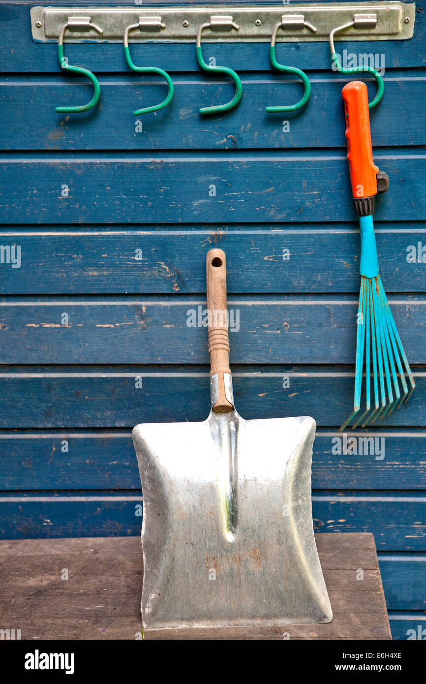 Shovel and cultivator, garden instruments on the blue wall, Vienna ...