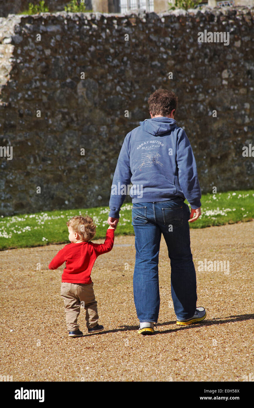 holding hands - toddler and adult walking Stock Photo - Alamy