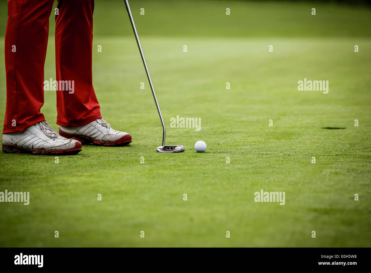 Golfers at Play, Ground Shot Stock Photo - Alamy