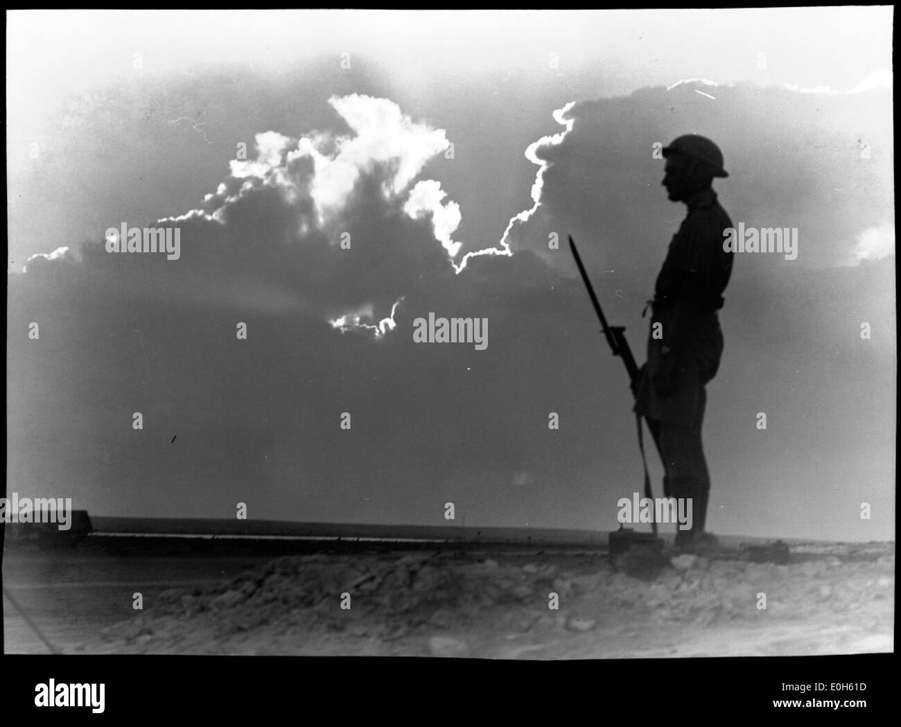 A lone soldier is silhouetted against the backdrop of the El Alamein ...
