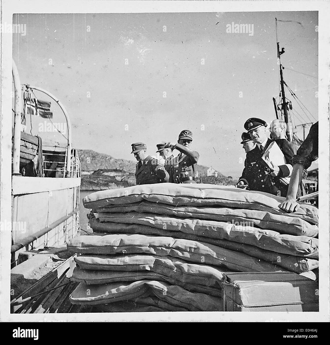 This historical image shows a German captain reporting to the ...