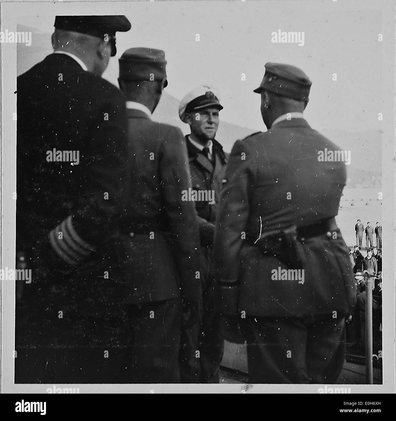 This image shows submarine commanders receiving congratulations during ...