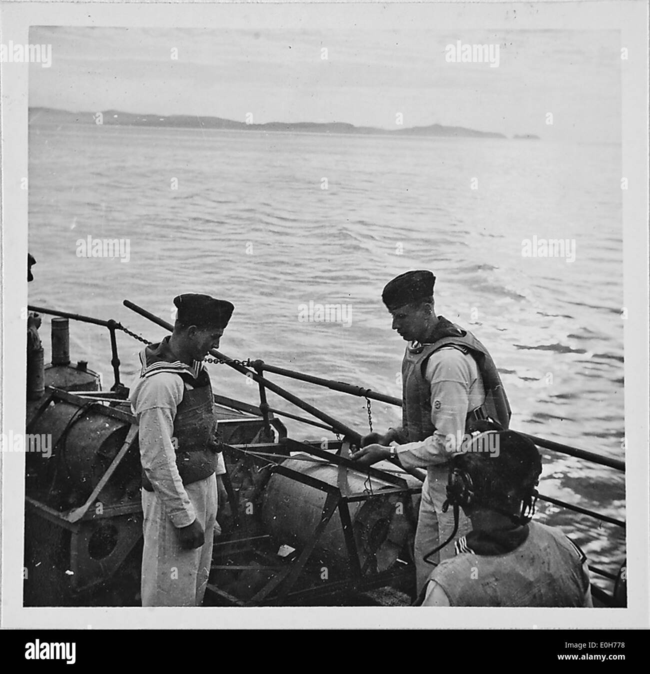 A historical photograph capturing the explosion of a depth charge ...