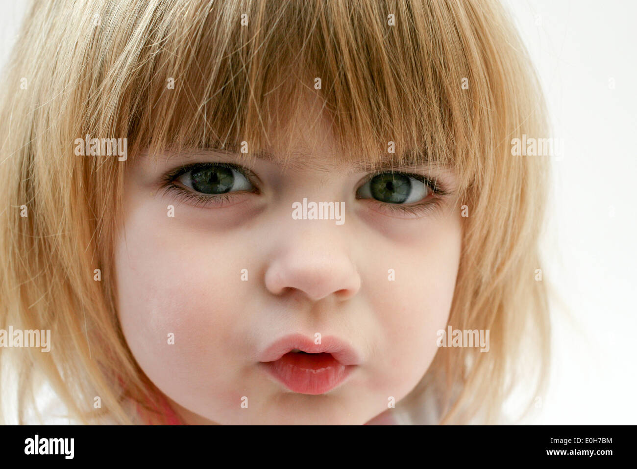 FOUR YEAR OLD GIRL PULLING FACES Stock Photo - Alamy