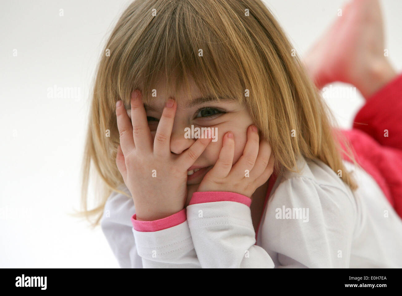 FOUR YEAR OLD GIRL PULLING FACES Stock Photo - Alamy