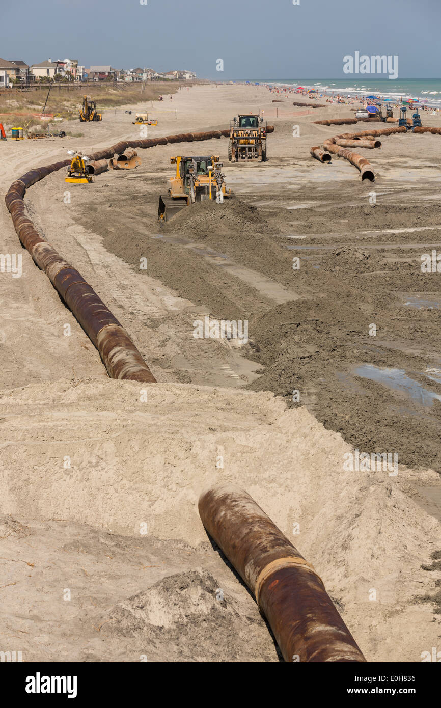 The Army Corps of Engineers use heavy machinery to restore the beach during a major beach ...