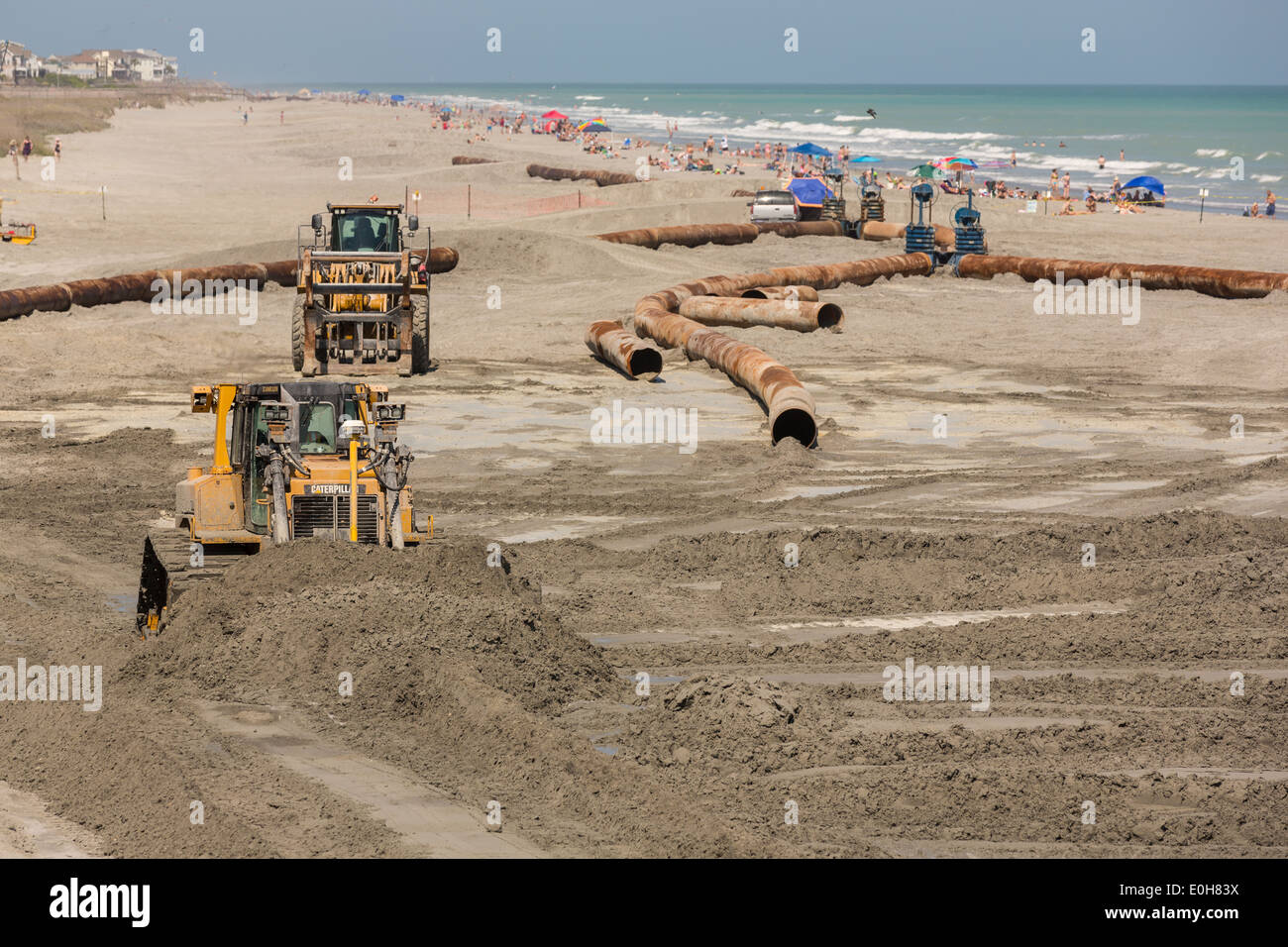 The Army Corps of Engineers use heavy machinery to restore the beach during a major beach ...