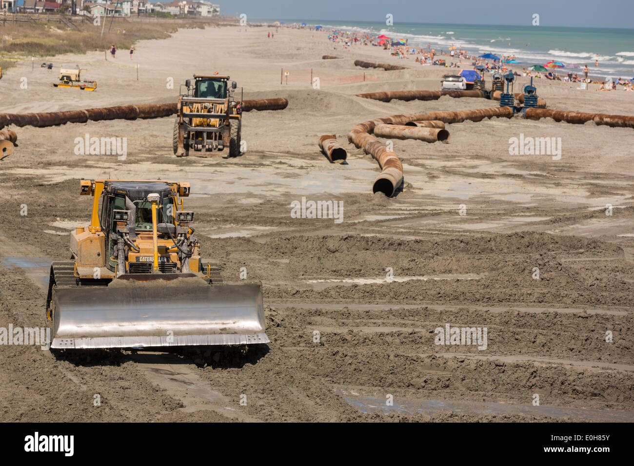 The Army Corps of Engineers use heavy machinery to restore the beach during a major beach ...