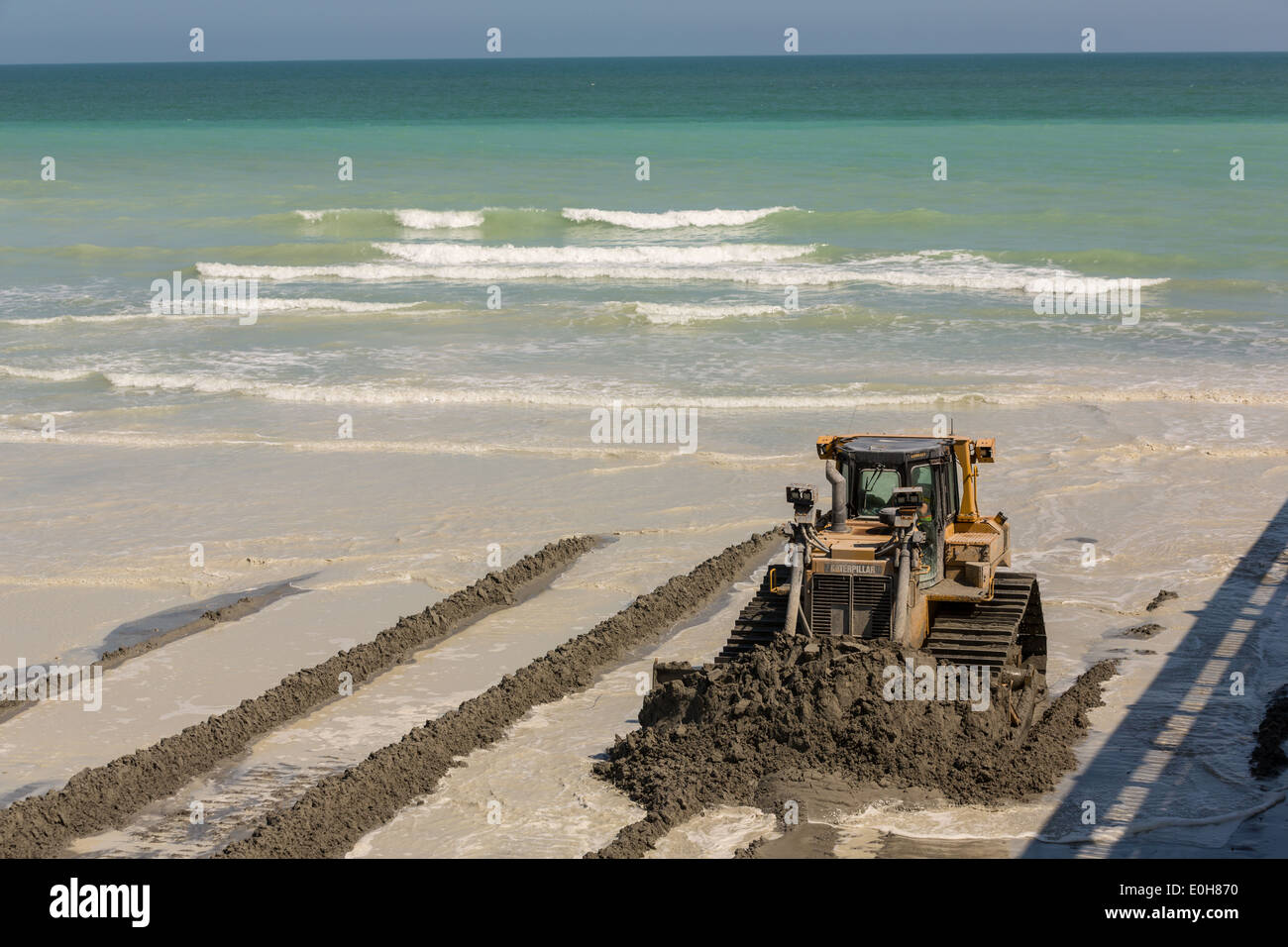 The Army Corps of Engineers use heavy machinery to restore the beach during a major beach ...