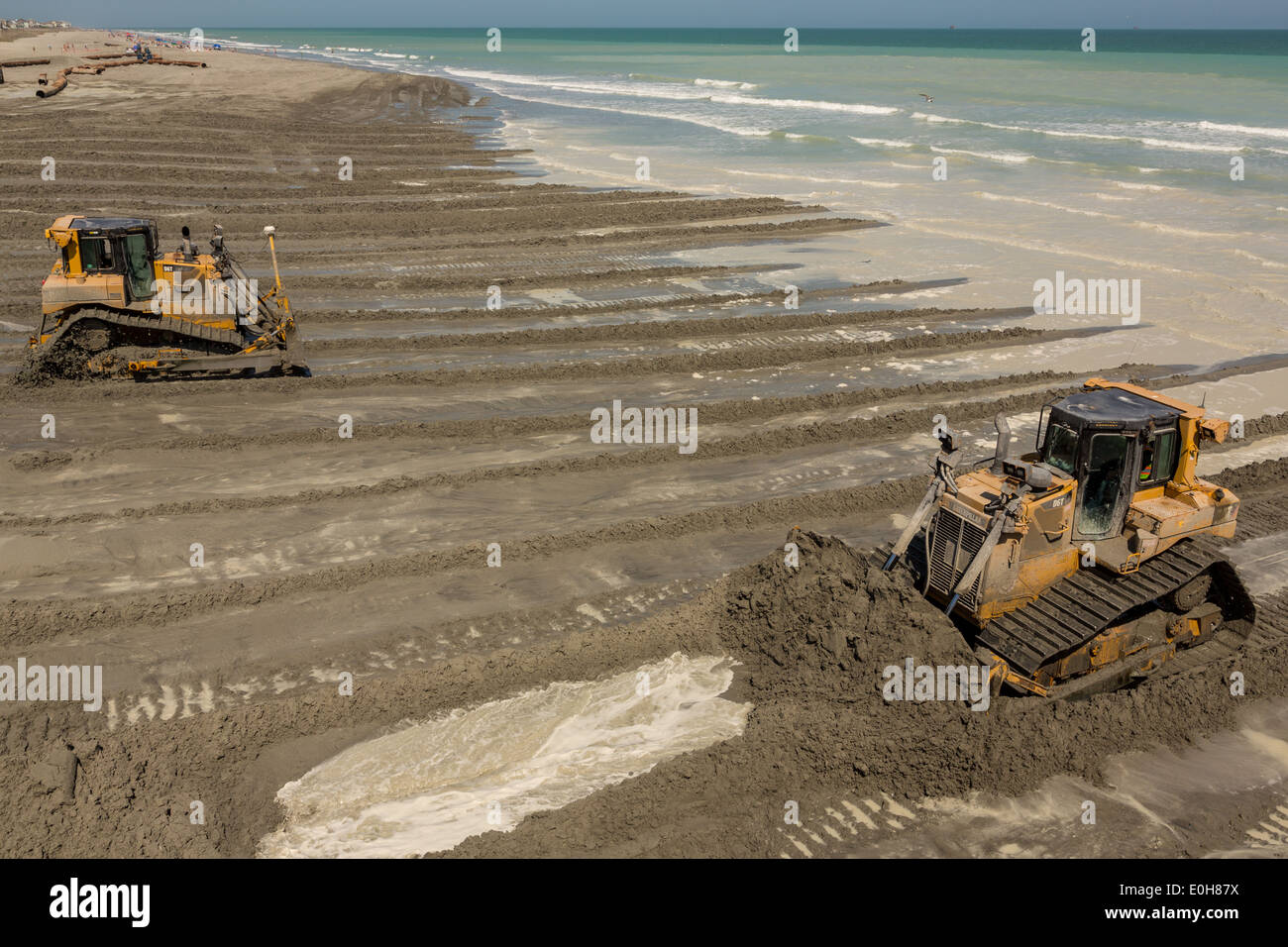 The Army Corps of Engineers use heavy machinery to restore the beach during a major beach ...