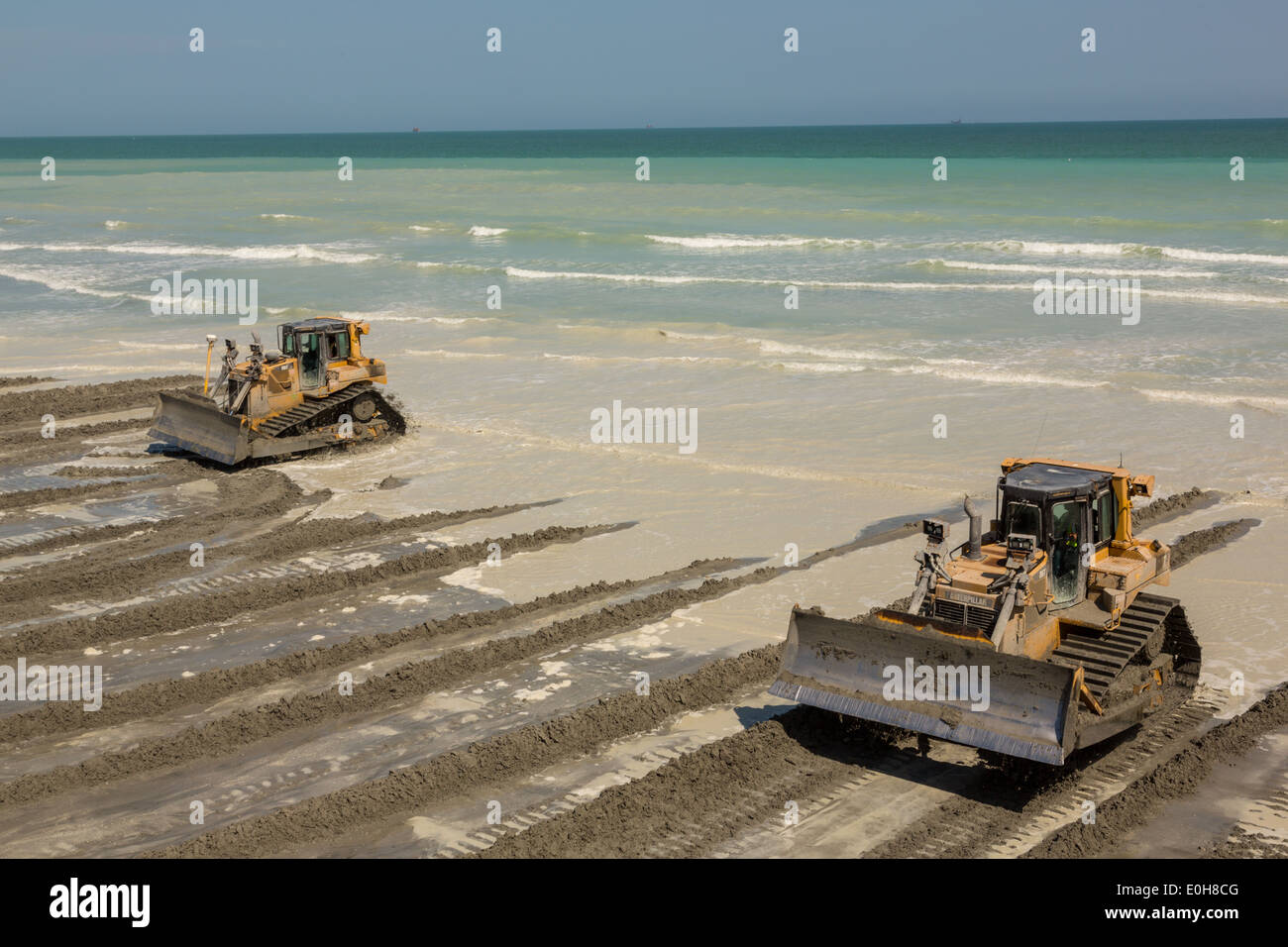 The Army Corps of Engineers use heavy machinery to restore the beach during a major beach ...