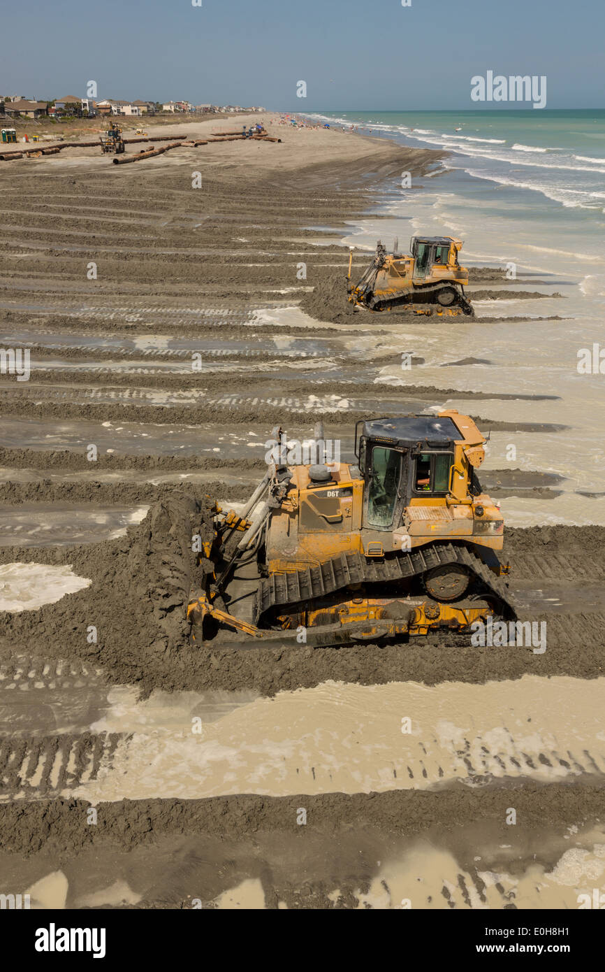The Army Corps of Engineers use heavy machinery to restore the beach during a major beach ...