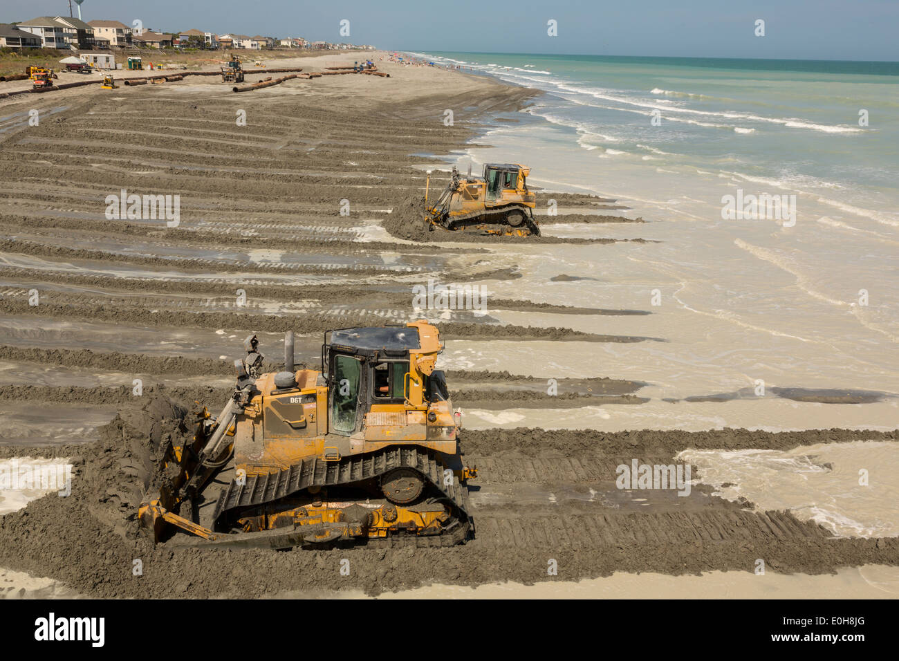 The Army Corps of Engineers use heavy machinery to restore the beach during a major beach ...