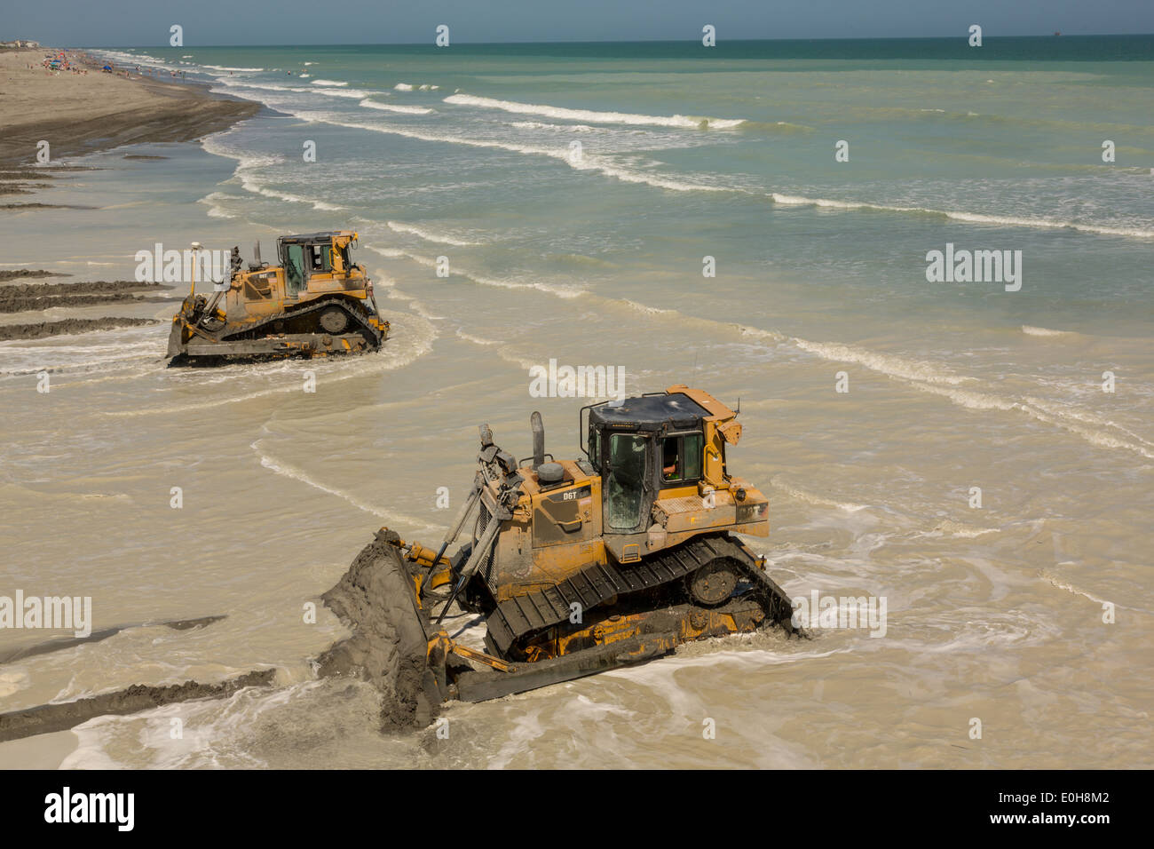 The Army Corps of Engineers use heavy machinery to restore the beach during a major beach ...