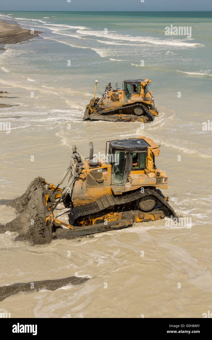 The Army Corps of Engineers use heavy machinery to restore the beach during a major beach ...