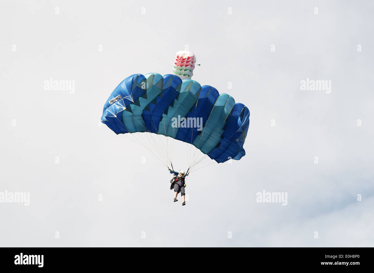 One day with parachutist in airfield. Girls skydivers landing under ...