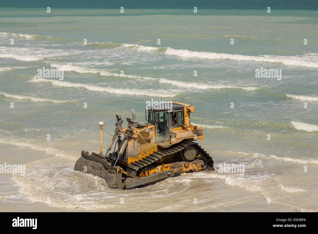 The Army Corps of Engineers use heavy machinery to restore the beach during a major beach ...