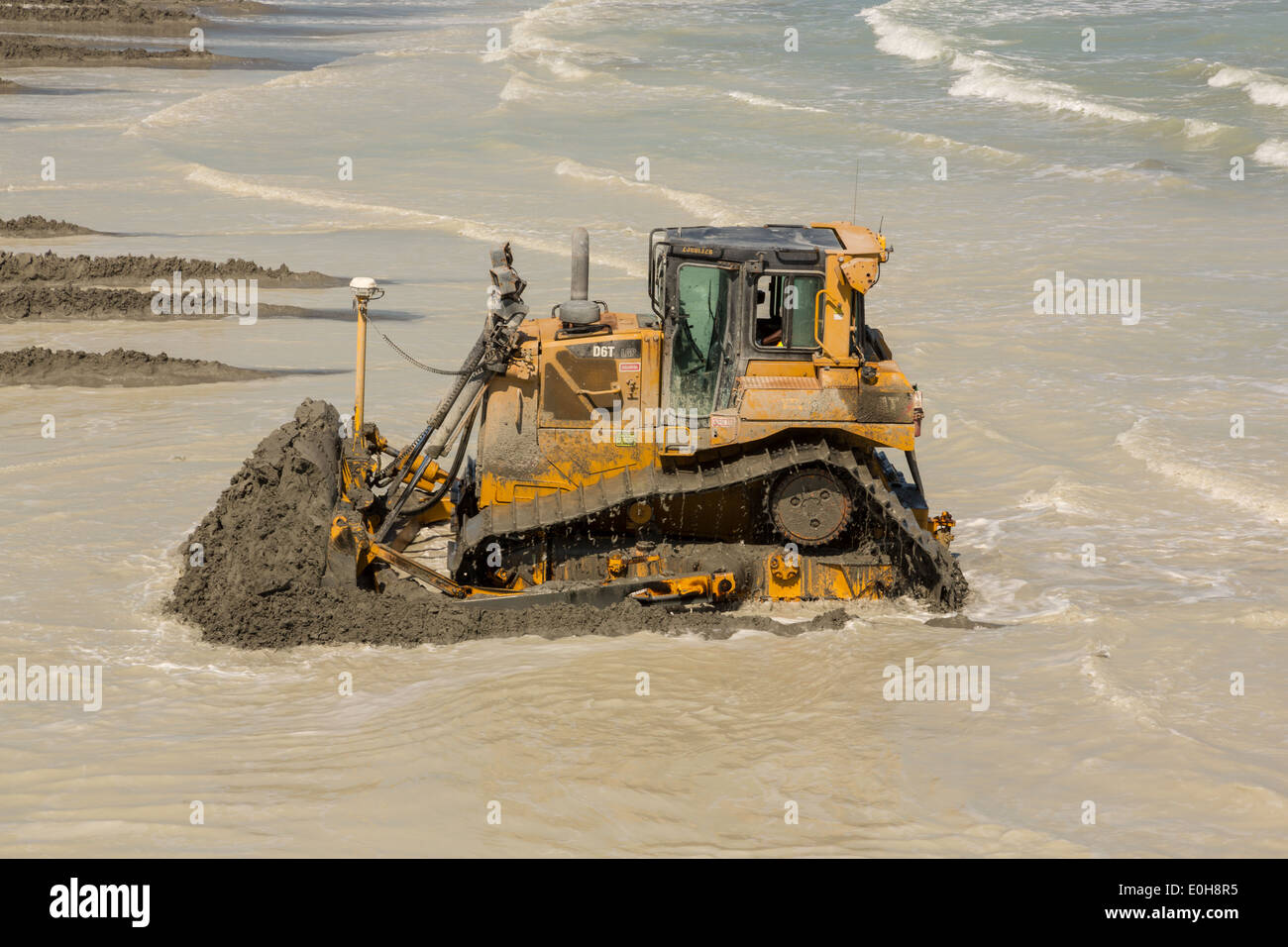 The Army Corps of Engineers use heavy machinery to restore the beach during a major beach ...