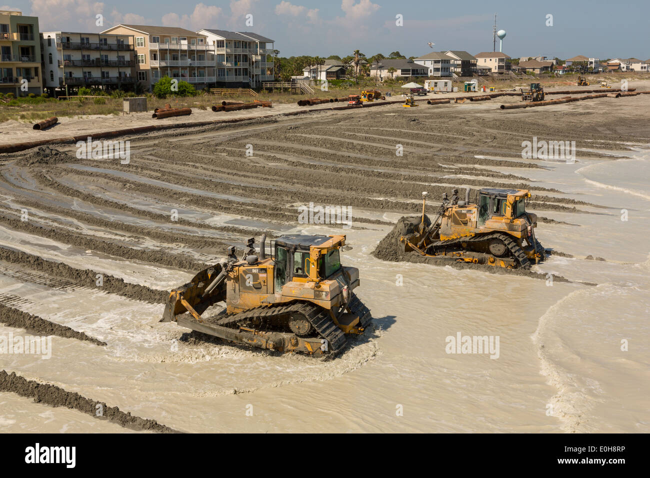 The Army Corps of Engineers use heavy machinery to restore the beach during a major beach ...