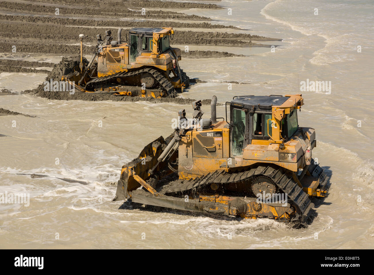 The Army Corps of Engineers use heavy machinery to restore the beach during a major beach ...