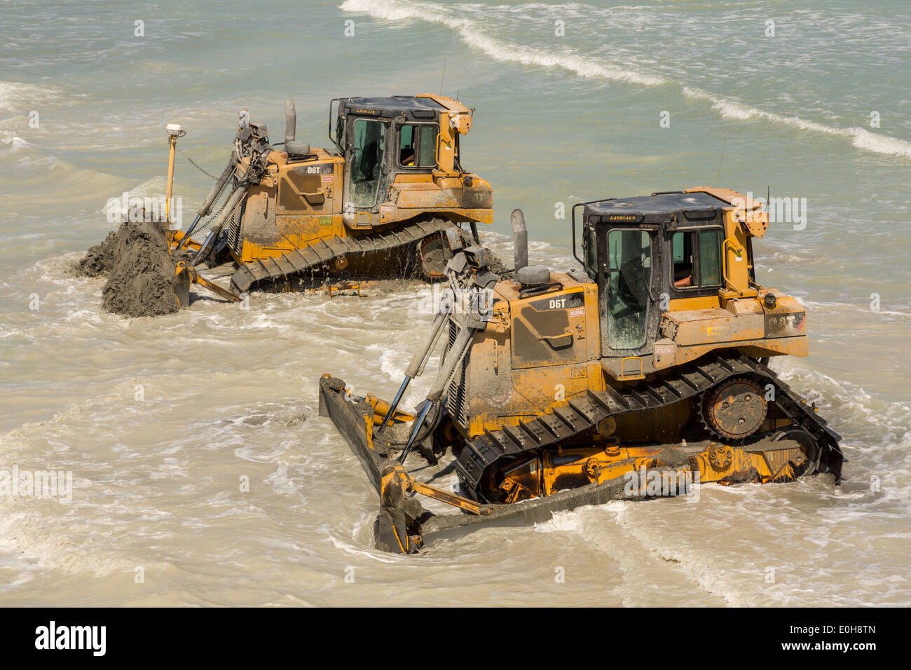 The Army Corps of Engineers use heavy machinery to restore the beach during a major beach ...