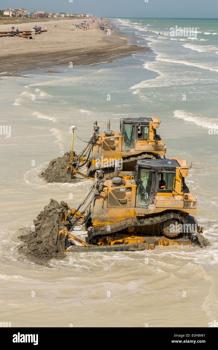 The Army Corps of Engineers use heavy machinery to restore the beach during a major beach ...