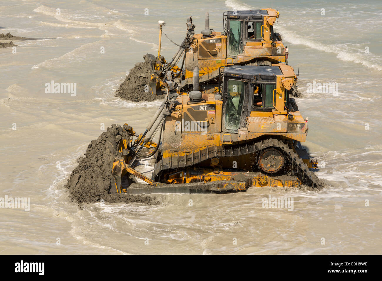 The Army Corps of Engineers use heavy machinery to restore the beach during a major beach ...