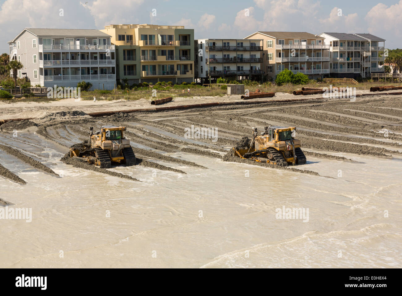 The Army Corps of Engineers use heavy machinery to restore the beach during a major beach ...