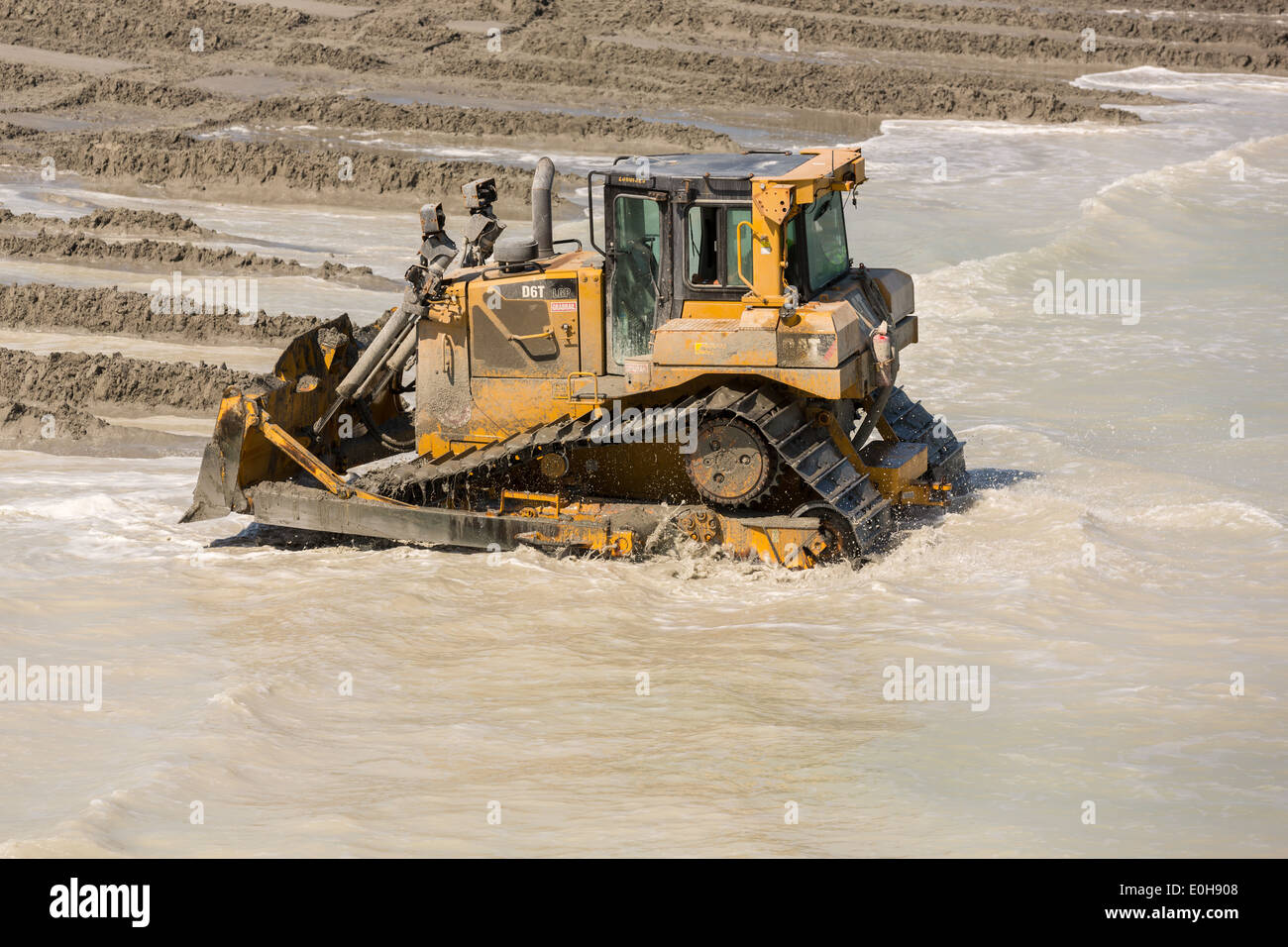 The Army Corps of Engineers use heavy machinery to restore the beach during a major beach ...