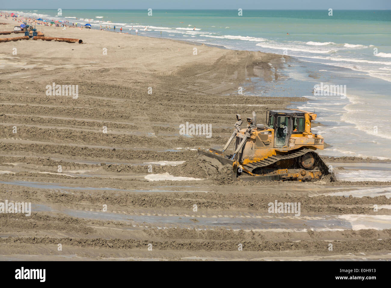 The Army Corps of Engineers use heavy machinery to restore the beach during a major beach ...