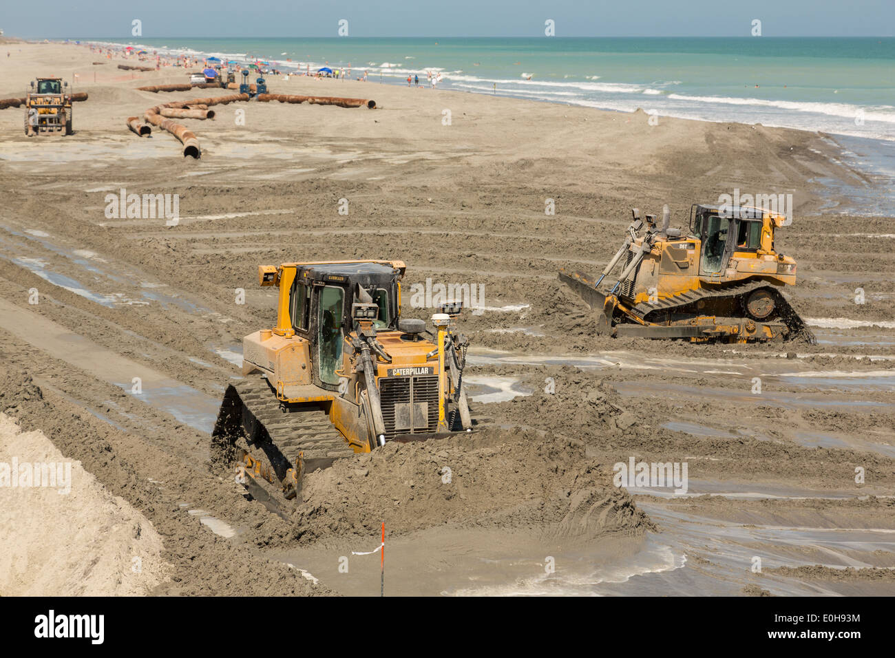 The Army Corps of Engineers use heavy machinery to restore the beach during a major beach ...