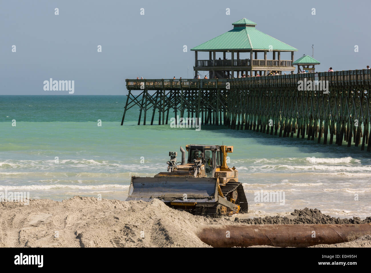 The Army Corps of Engineers use heavy machinery to restore the beach during a major beach ...