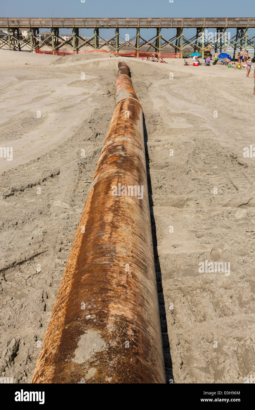 The Army Corps of Engineers uses a large pipeline to restore the beach during a major beach ...
