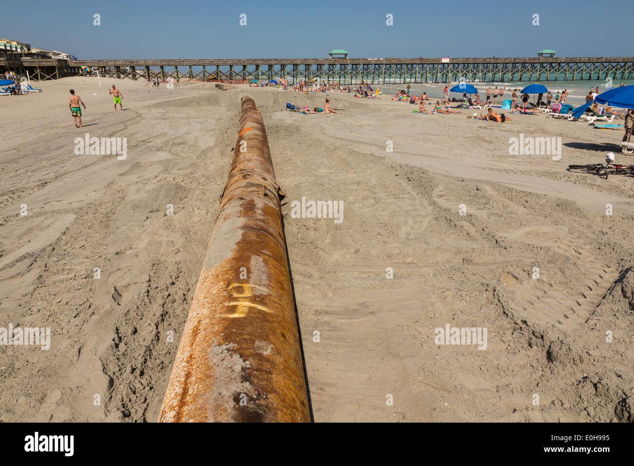 The Army Corps of Engineers uses a large pipeline to restore the beach during a major beach ...