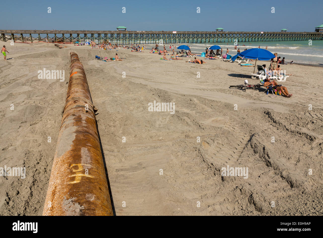 The Army Corps of Engineers uses a large pipeline to restore the beach during a major beach ...