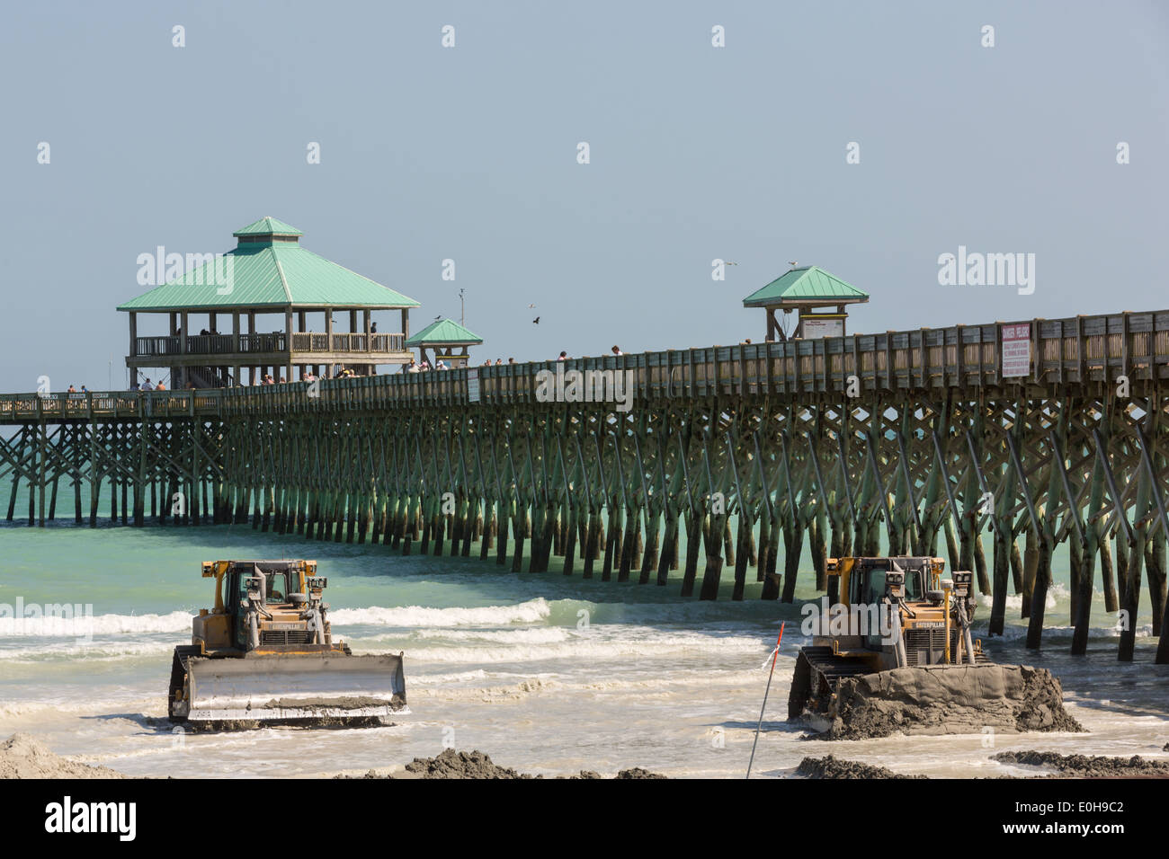 The Army Corps of Engineers use heavy machinery to restore the beach during a major beach ...