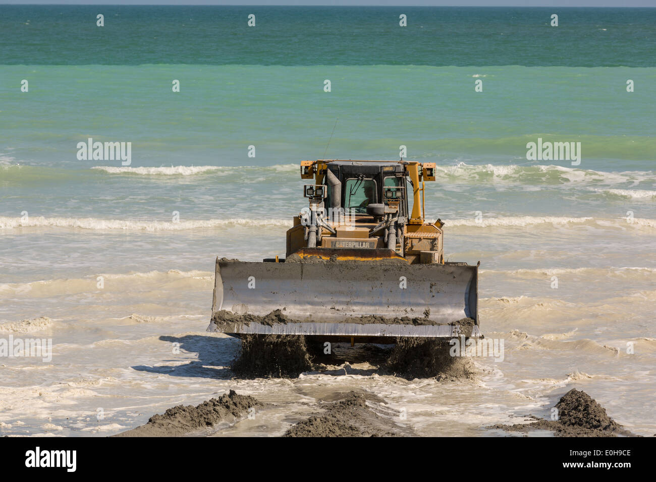 The Army Corps of Engineers use heavy machinery to restore the beach during a major beach ...