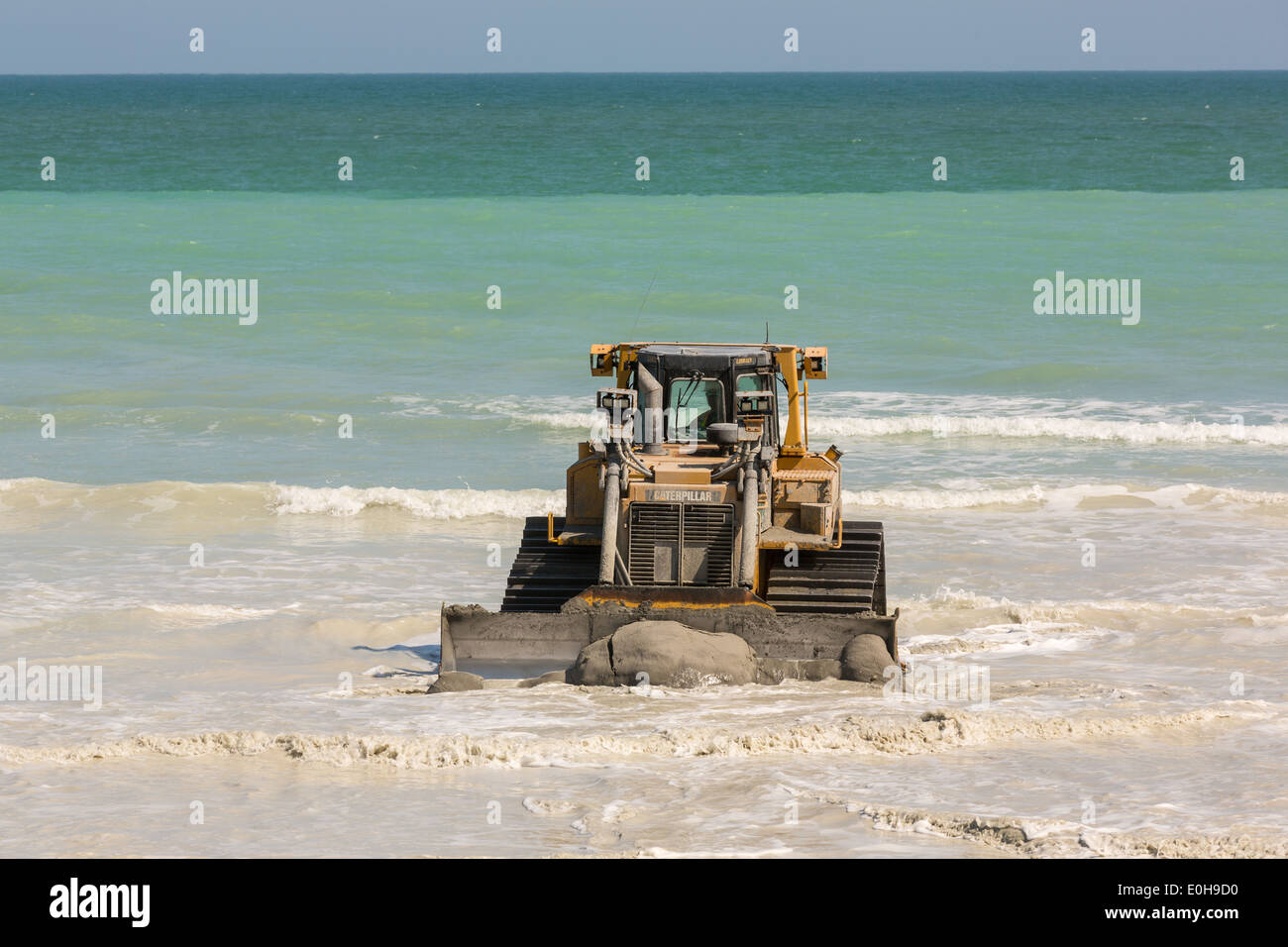 The Army Corps of Engineers use heavy machinery to restore the beach during a major beach ...