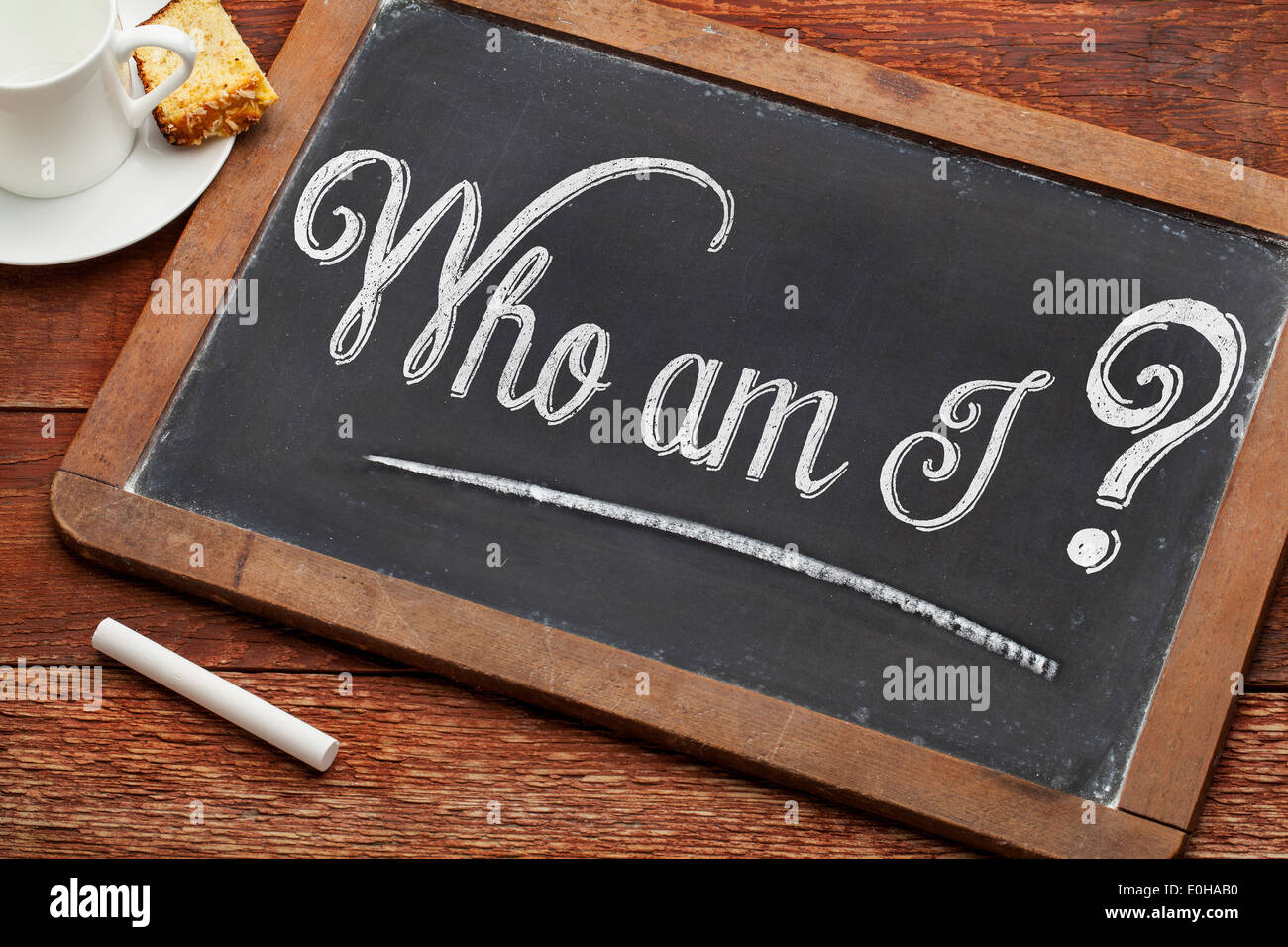 Who am I ? A philosophical question on a vintage blackboard with white ...