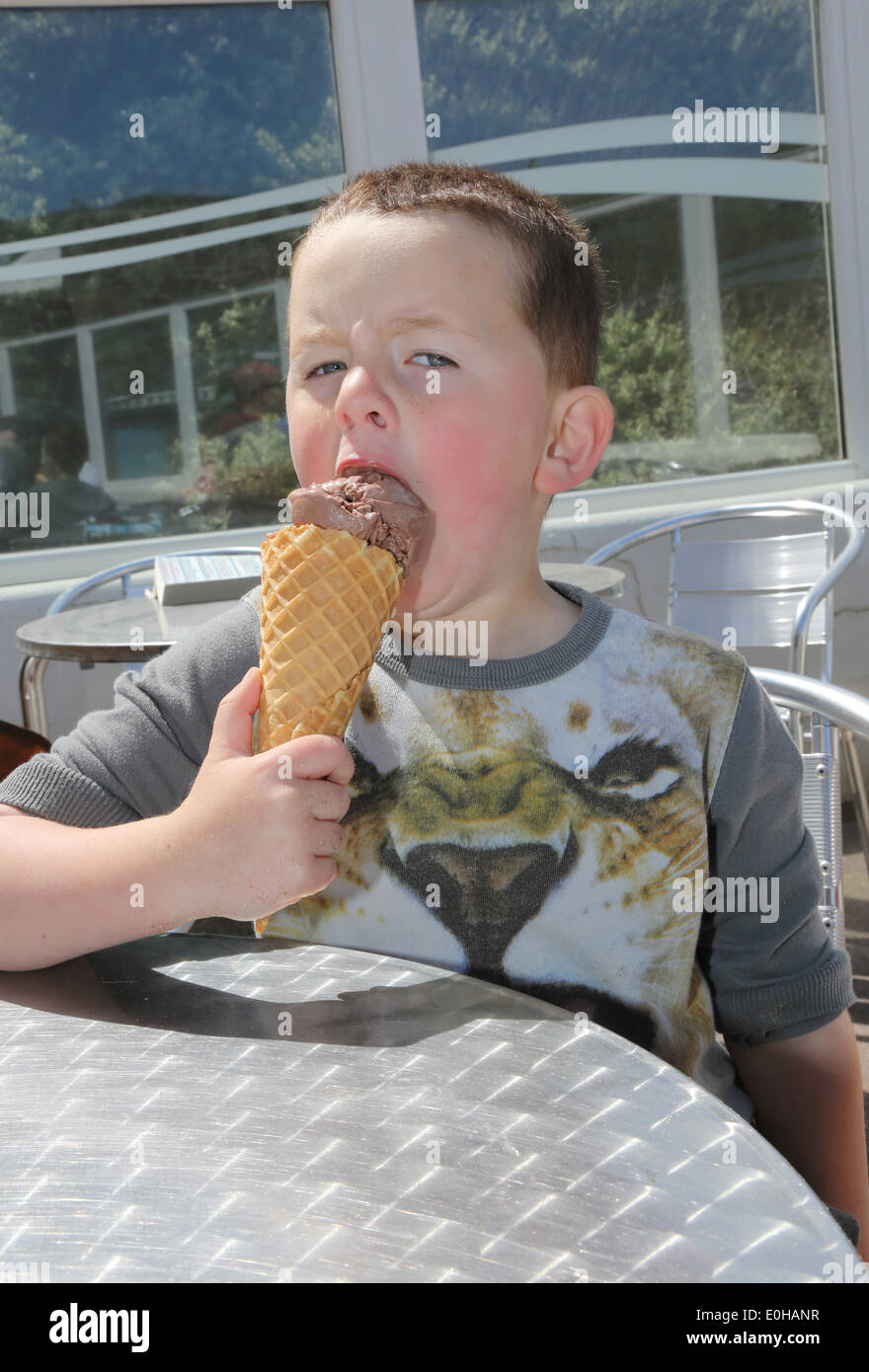 Child licking his icecream Stock Photo - Alamy