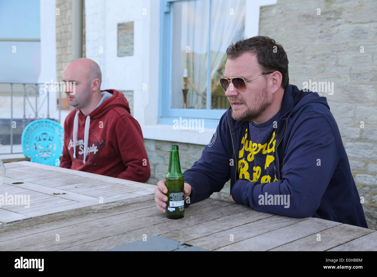 Men drinking beer Stock Photo - Alamy