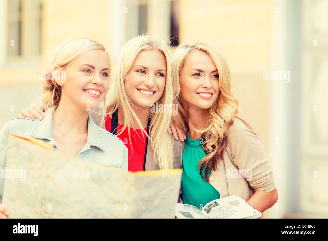 beautiful women with tourist map in the city Stock Photo - Alamy