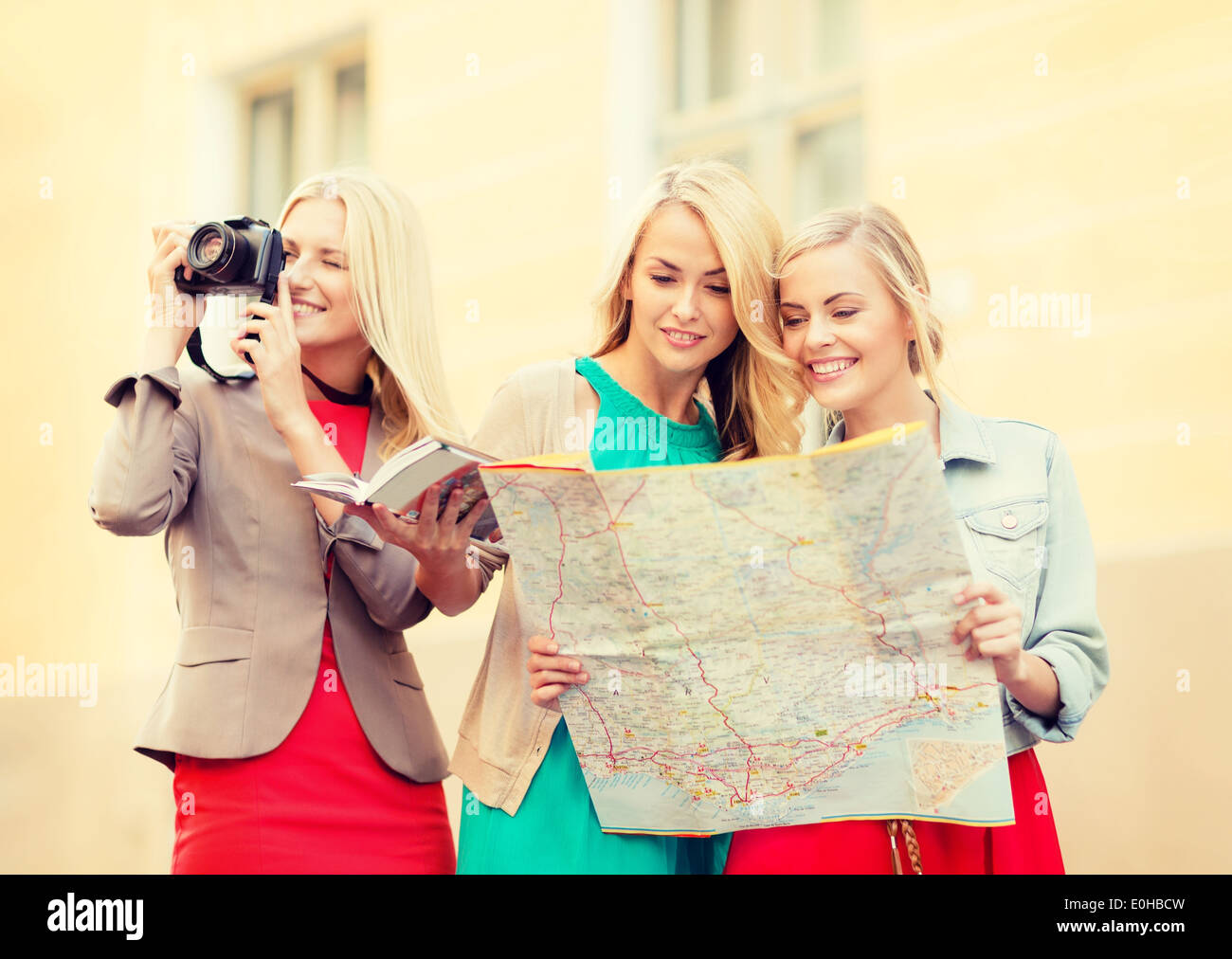 women with tourist map and camera in the city Stock Photo - Alamy